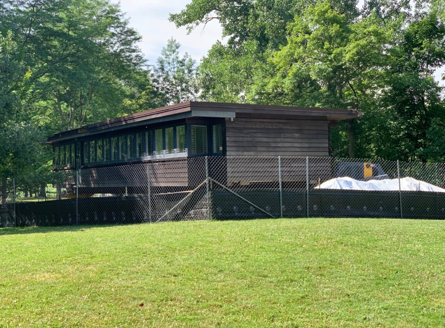 Fenced off Booth Cottage before Move - Frank Lloyd Wright Foundation